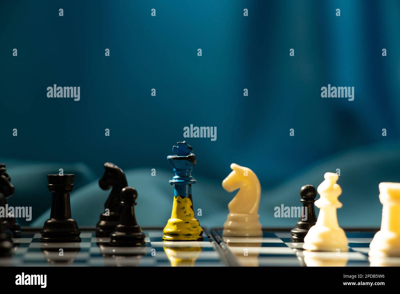 Chess king in the color of the flag of Ukraine on a chessboard, chess ...