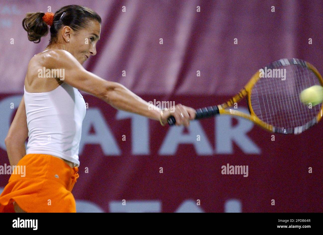 Selima Sfar of Tunisia returns to her opponent Ai Sugiyama of Japan ...