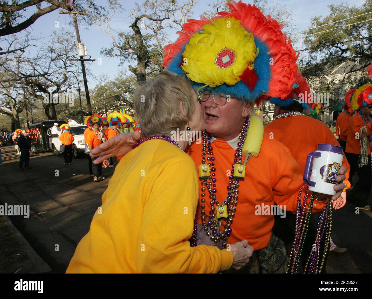 Greg Tobin gets a kiss from Margaret Dolan as members of Pete Fountain ...