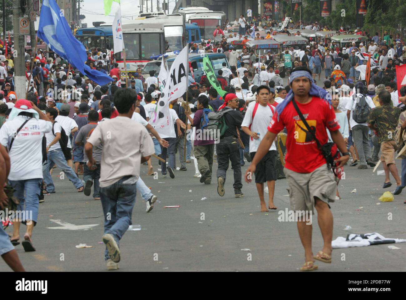 Protesters flee as riot police disperse them when they tried to march ...