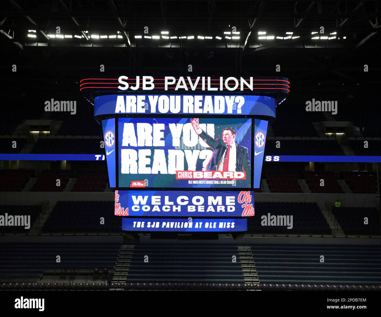 The scoreboard announces the hiring of Chris Beard as the new ...