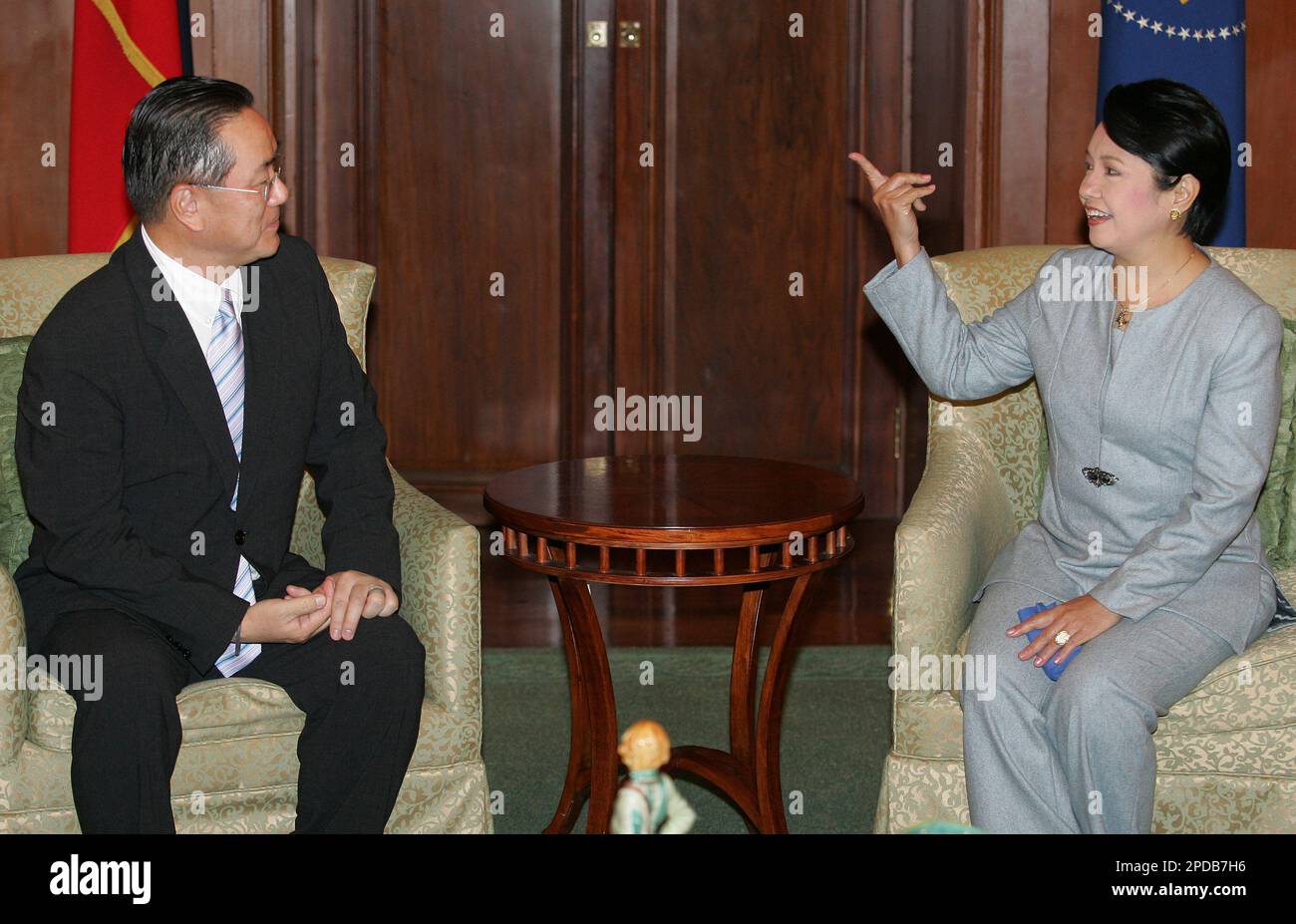 Philippine President Gloria Macapagal Arroyo, right, gestures as she ...