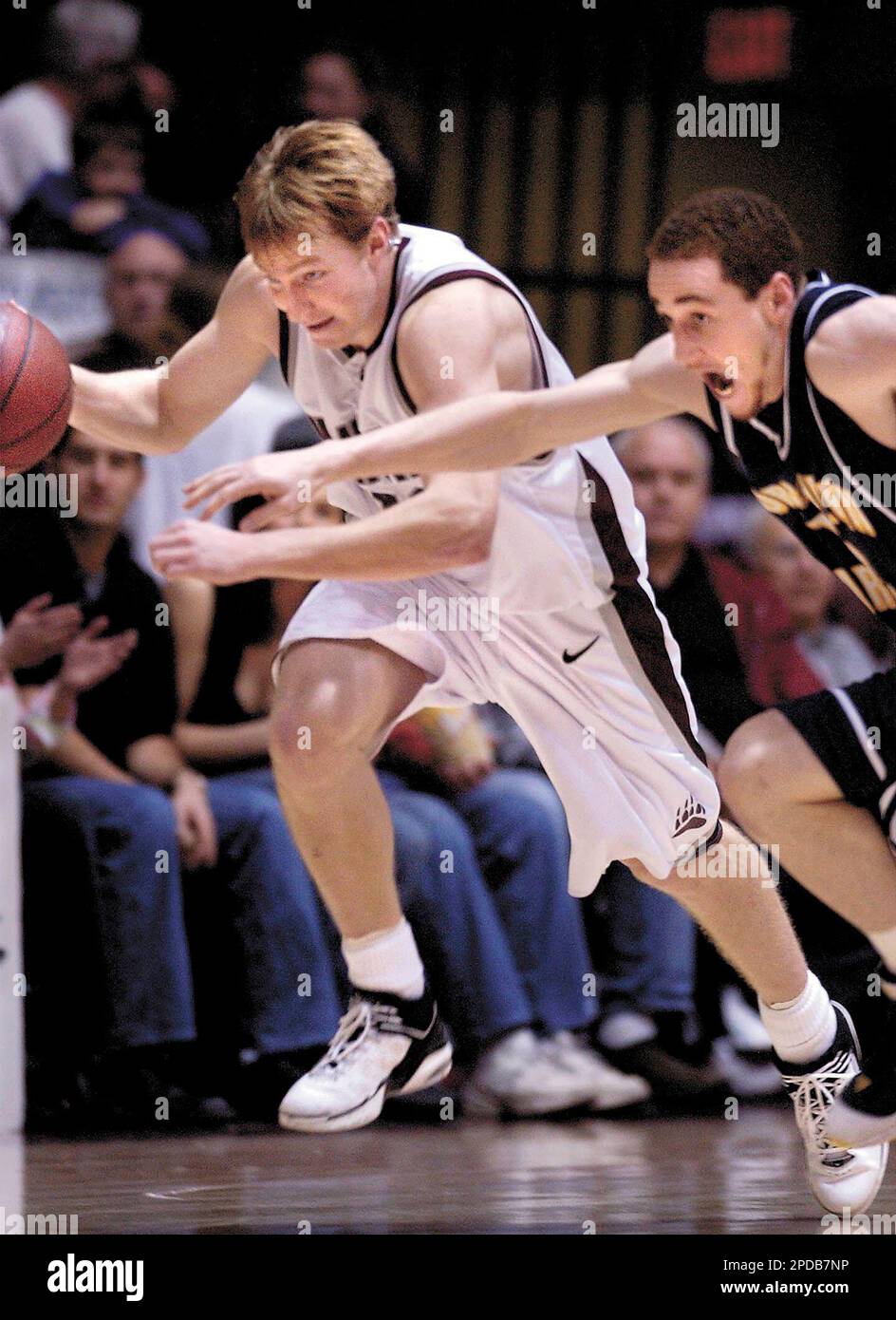 Montana's Kevin Criswell, left, heads down court after stealing the ...