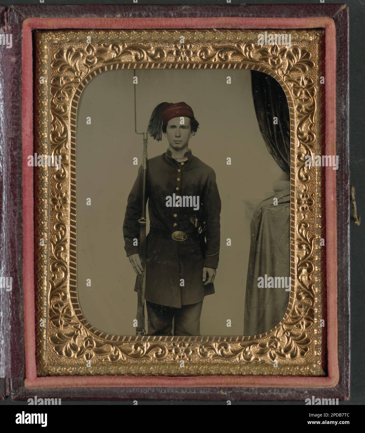 Unidentified soldier in Union uniform, with smoking fez and U.S. buckle ...