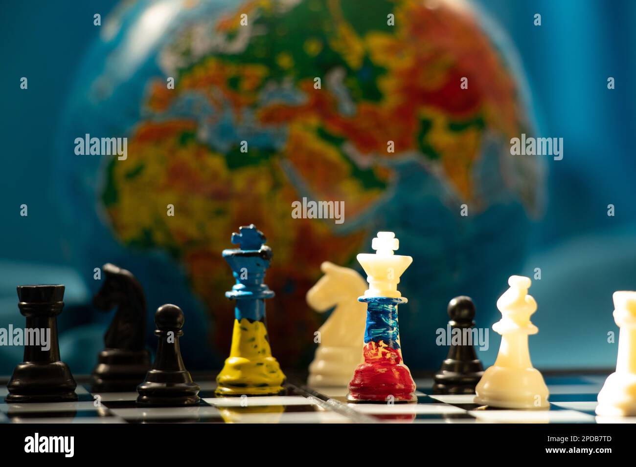 Chess kings in the colors of the flag of Ukraine and the flag of Russia ...