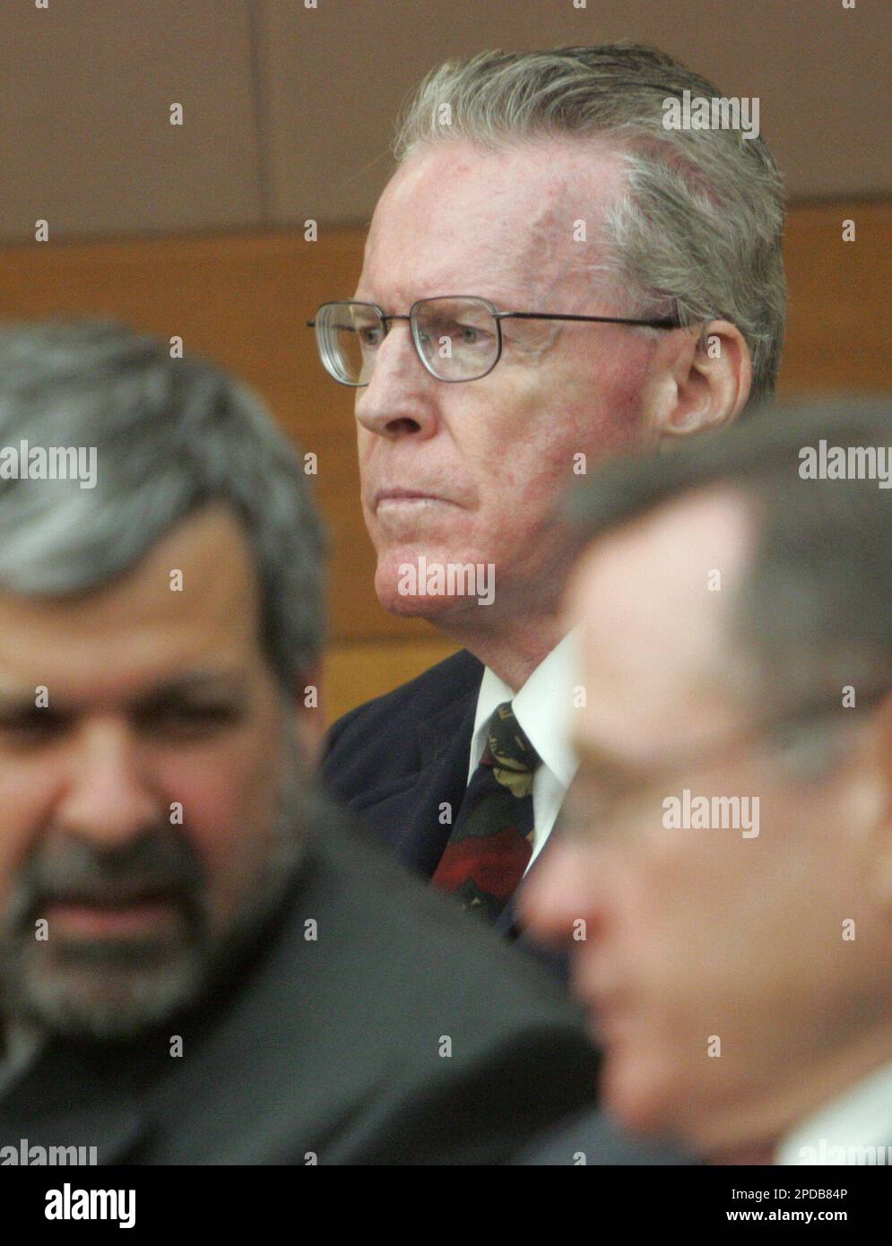 James Sullivan, center, watches the proceedings as his attorneys Donald ...