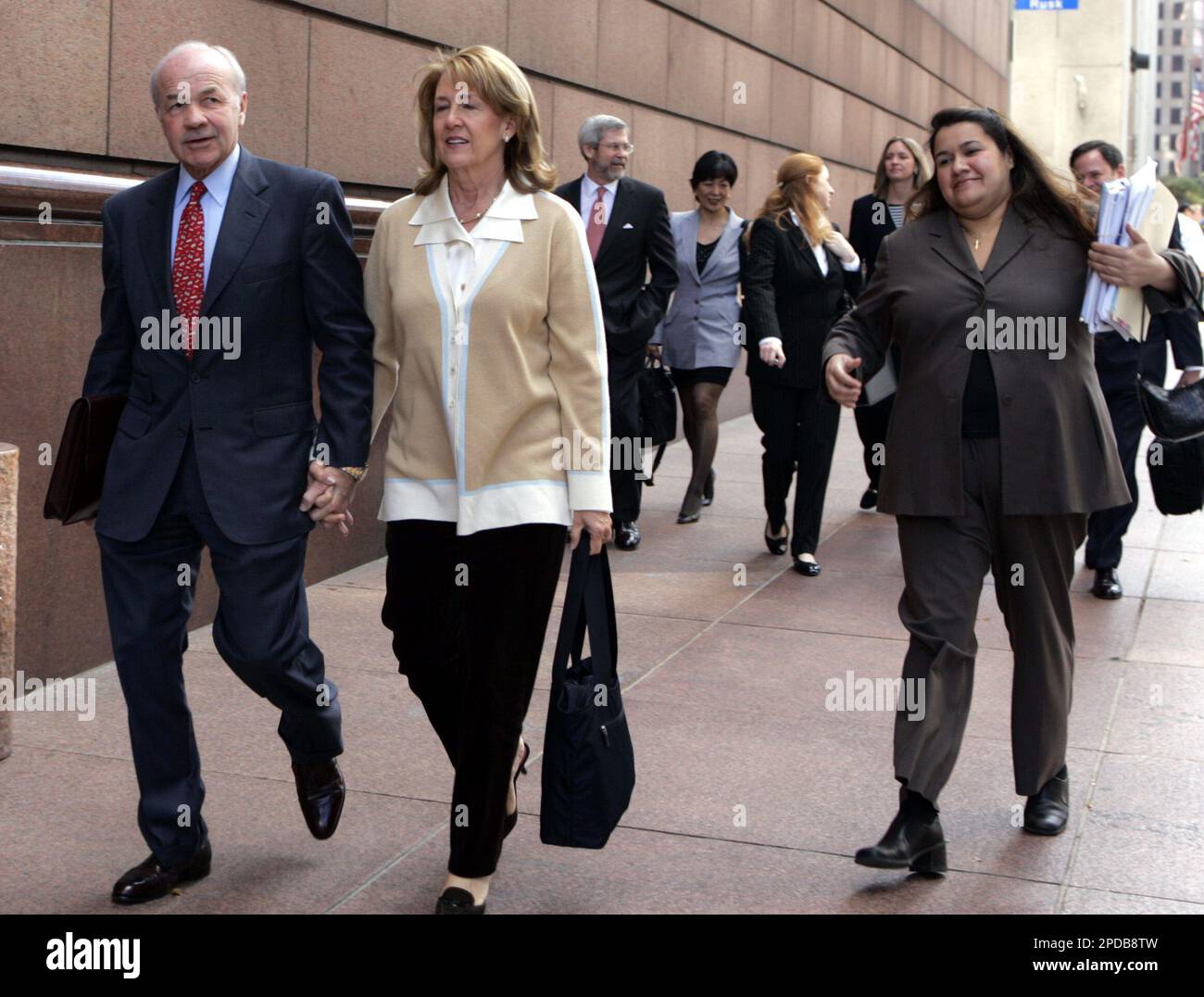 Former Enron CEO Kenneth Lay and his wife Linda lead the way from the ...
