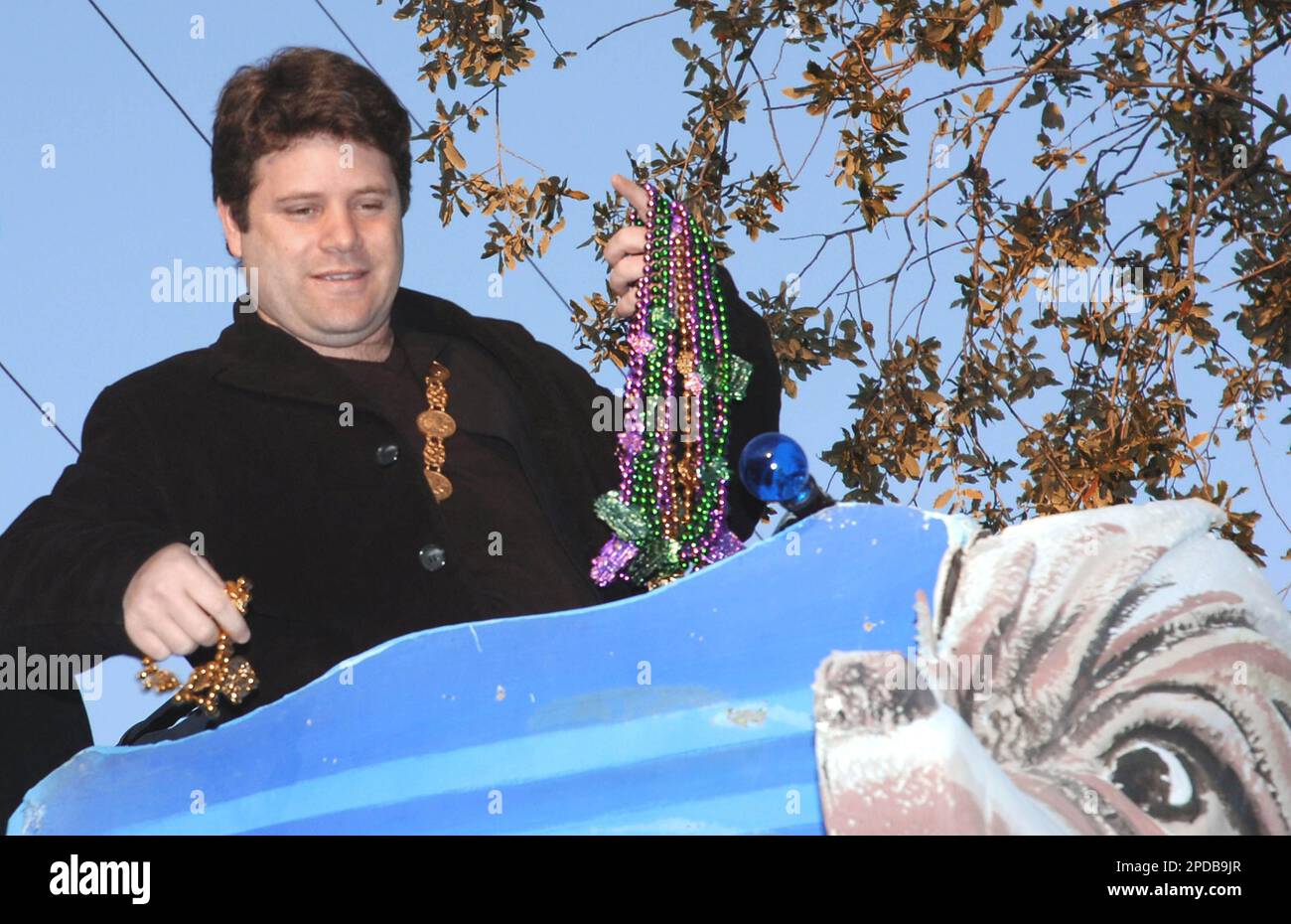 Actor Sean Astin throws Mardi Gras beads from atop a float during the ...