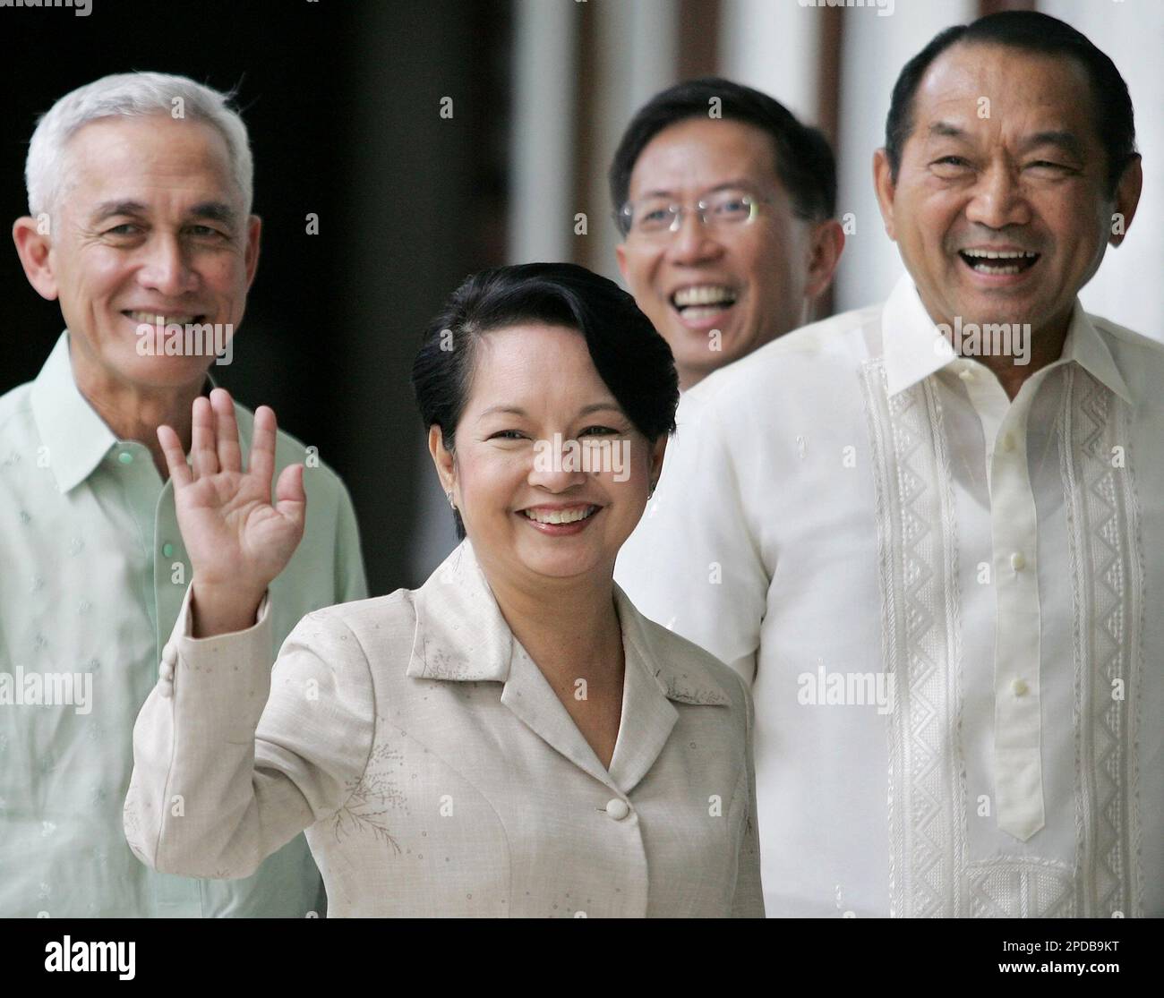 Philippine President Gloria Macapagal Arroyo, second from left, waves ...