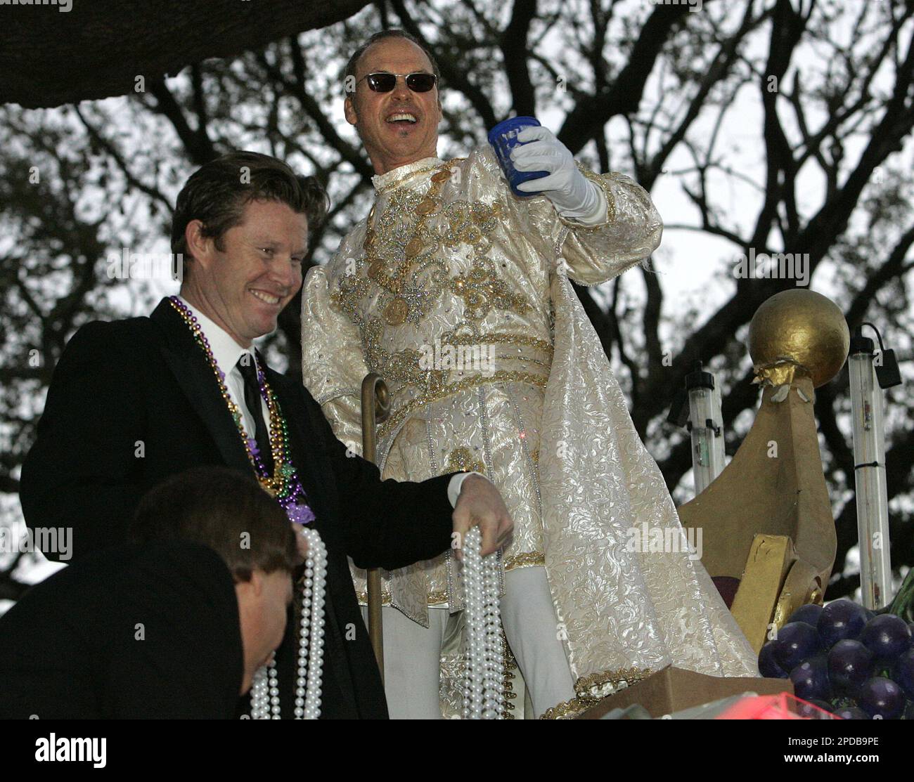 Actor Michael Keaton stands atop a float leading the Bacchus Parade in ...