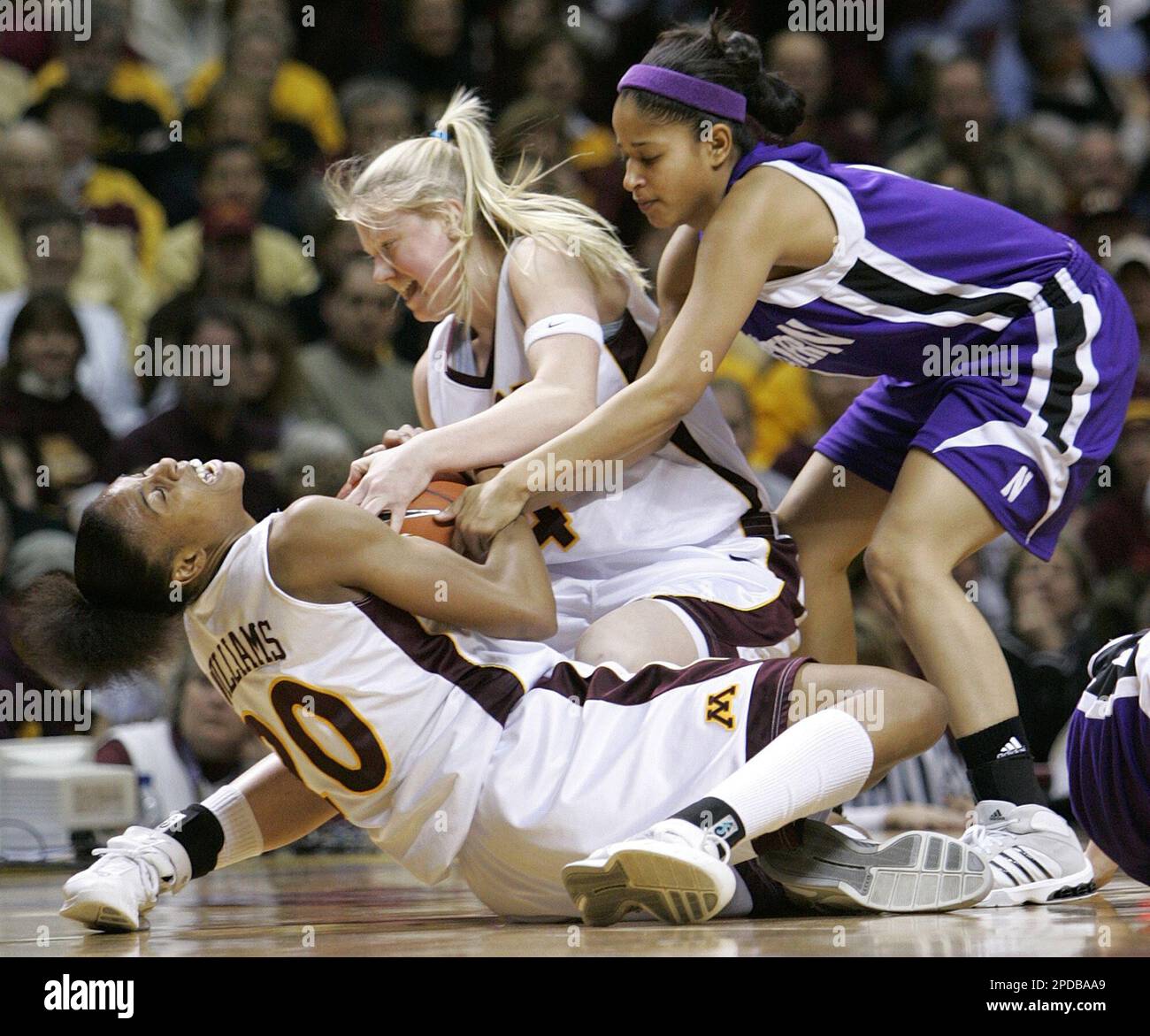 Minnesota forward Natasha Williams, left, and guard Emily Fox, center ...