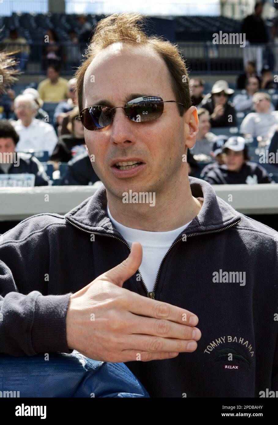 New York Yankees general manager Brian Cashman speaks to a reporter ...