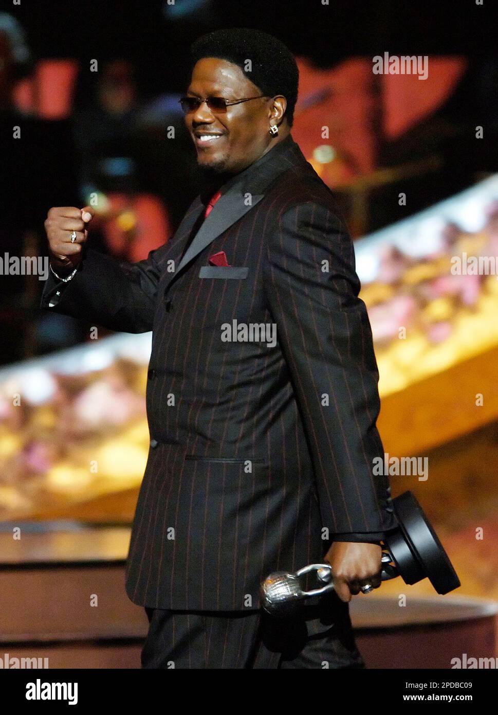 Bernie Mac walks offstage with his award for Outstanding Actor in a ...