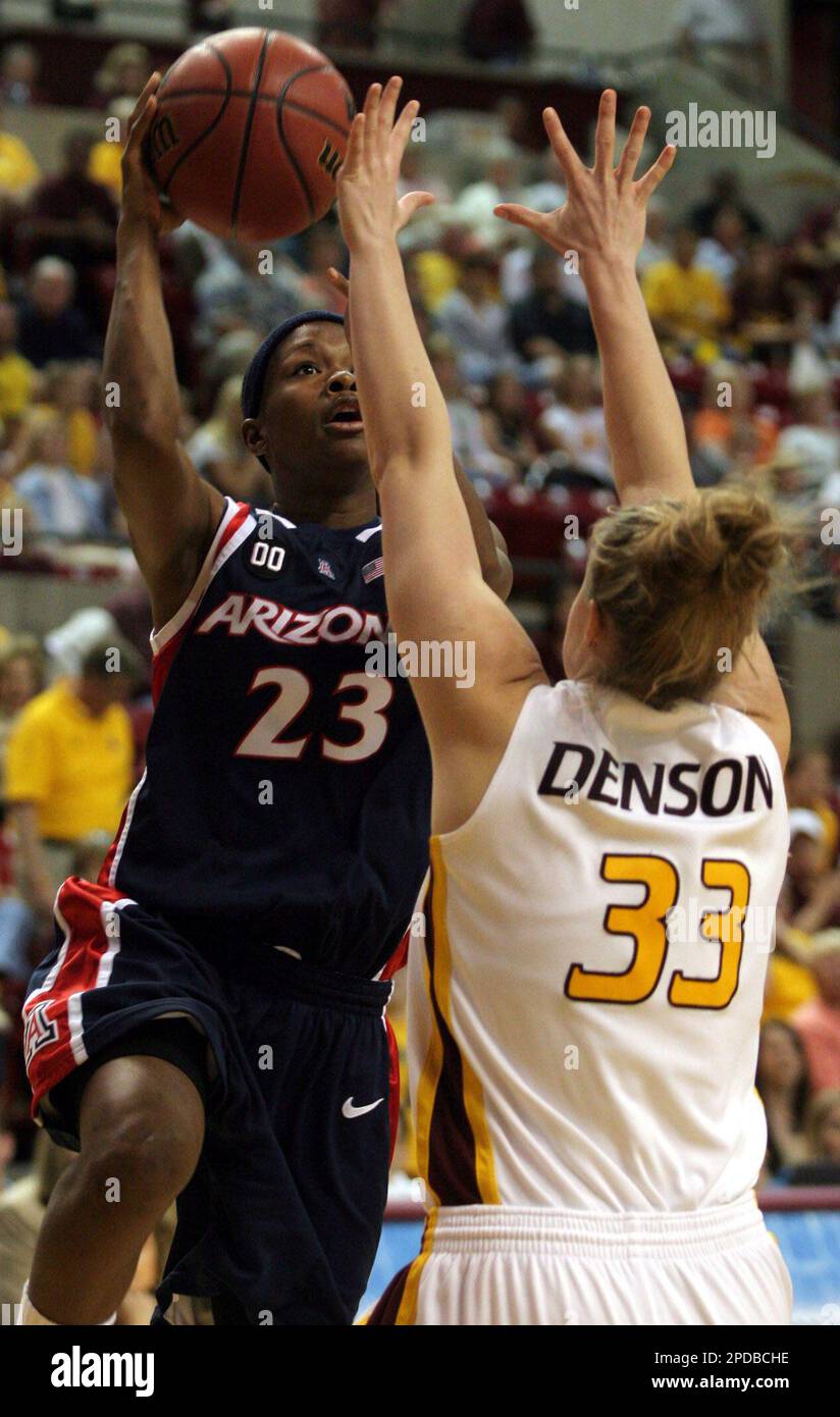 Arizona guard Natalie Jones (23) shoots over Arizona State's Amy Denson ...