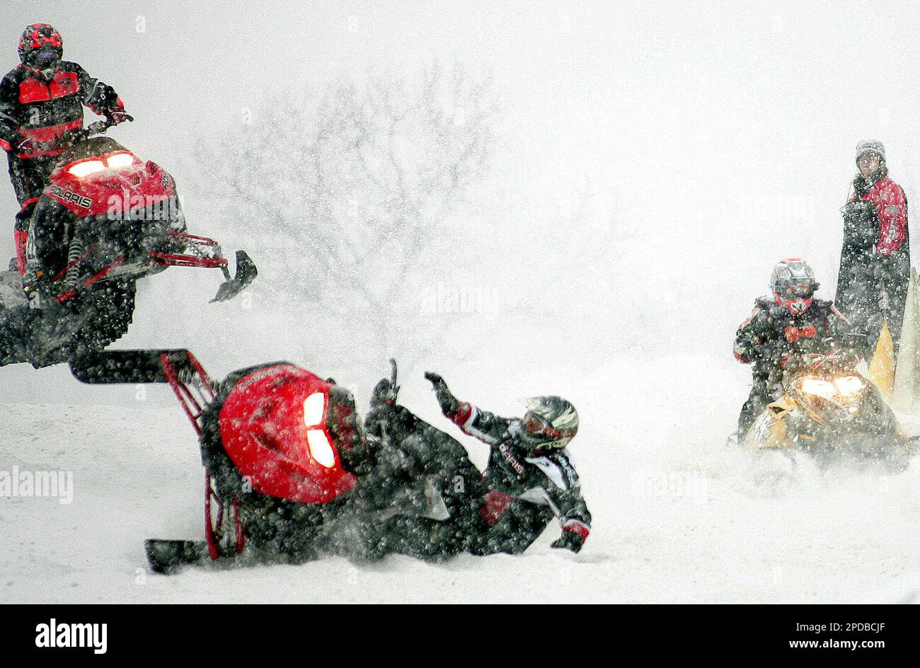 The drive of a snow machine crashes after going over a jump during the ...