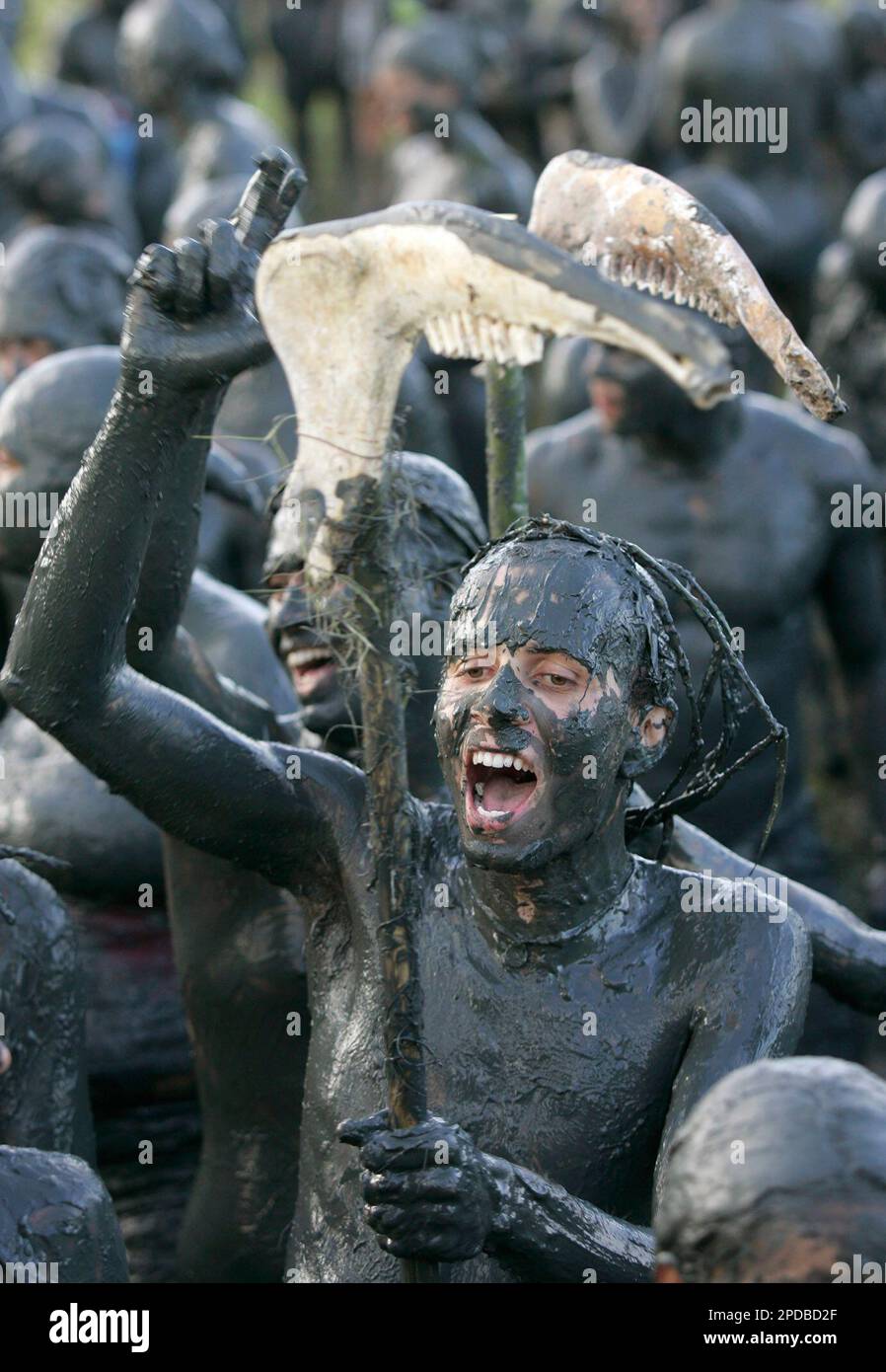 A member of the traditional Block of the Mud dress up as a cavemen ...