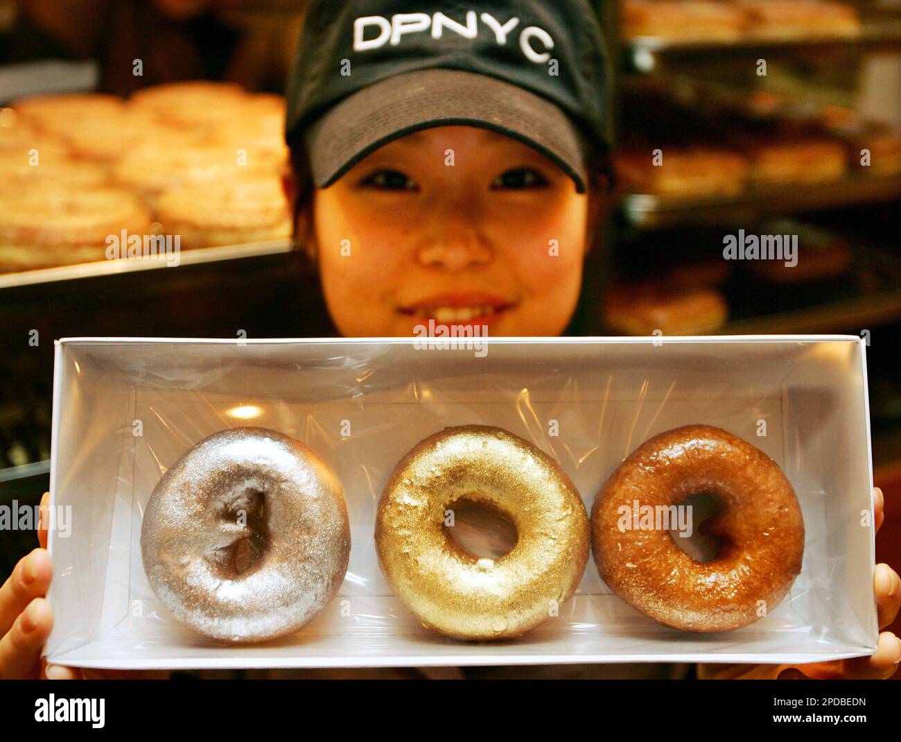 An employee at Tokyo pastry chain Doughnut Plant NYC shows off Winter ...