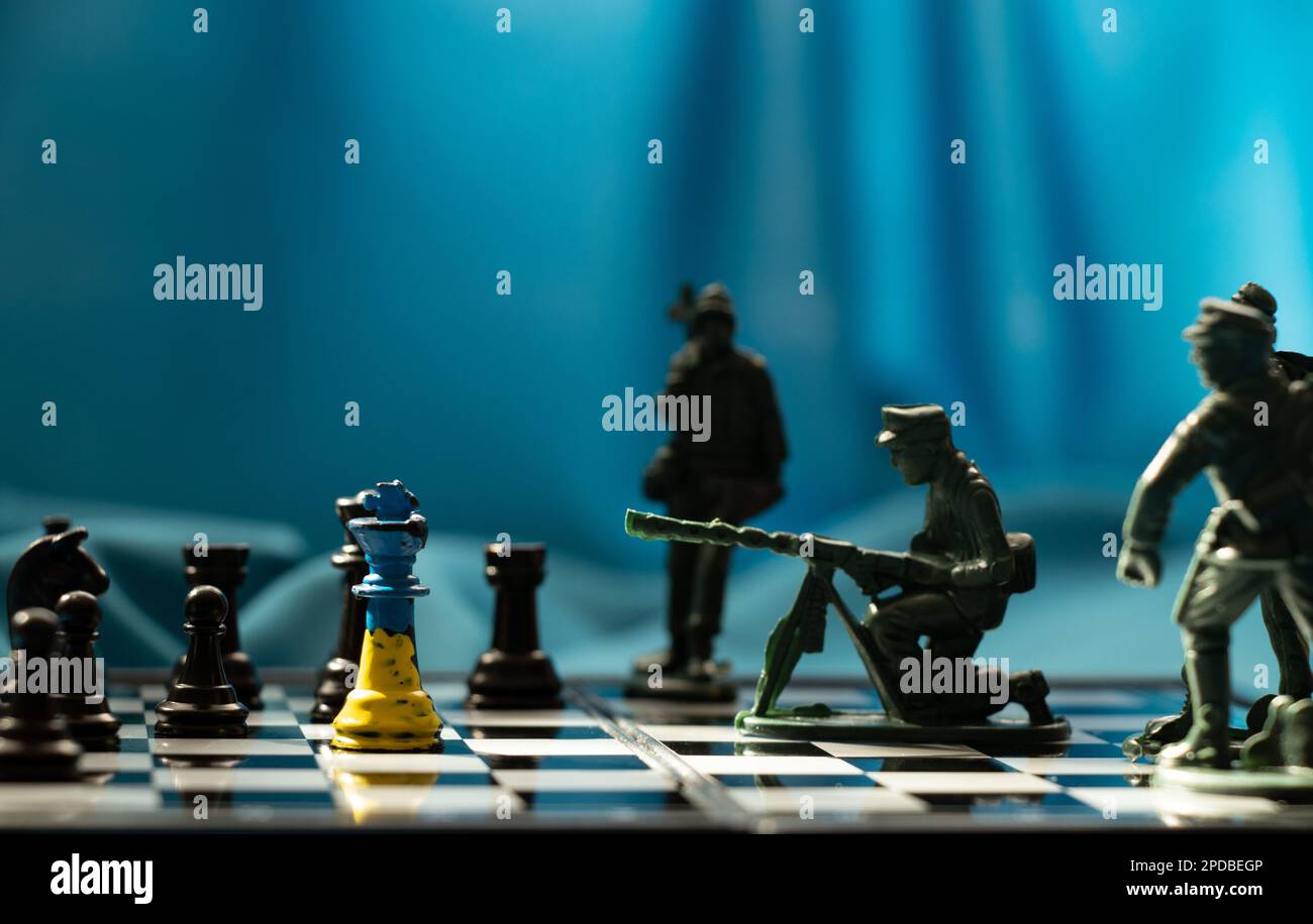 Chess king in the colors of the flag of Ukraine on a chessboard with ...