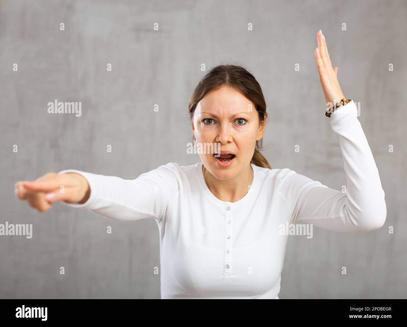 Woman argues while pointing accusingly with fury and anger Stock Photo ...