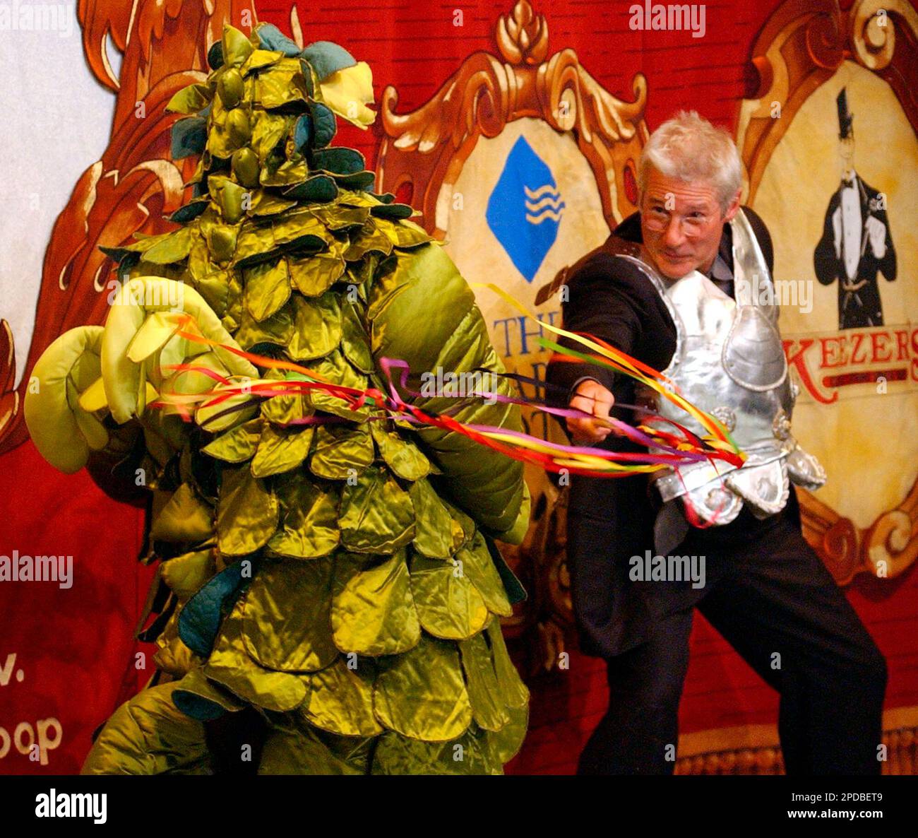 Actor Richard Gere appears to slay a dragon during Hasty Pudding ...
