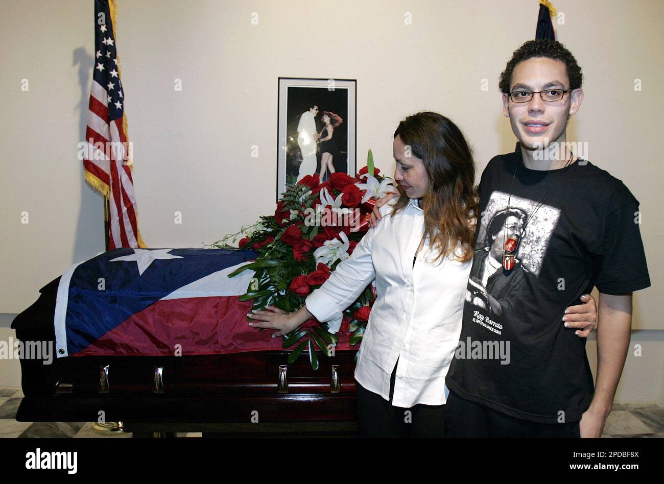 Ray Barretto's widow, Annette Barreto, left, touches his husband's ...
