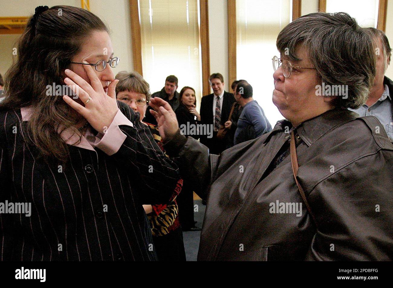 Trena Gage, mother of Jetseta Gage, left, wipes away a tear as she ...