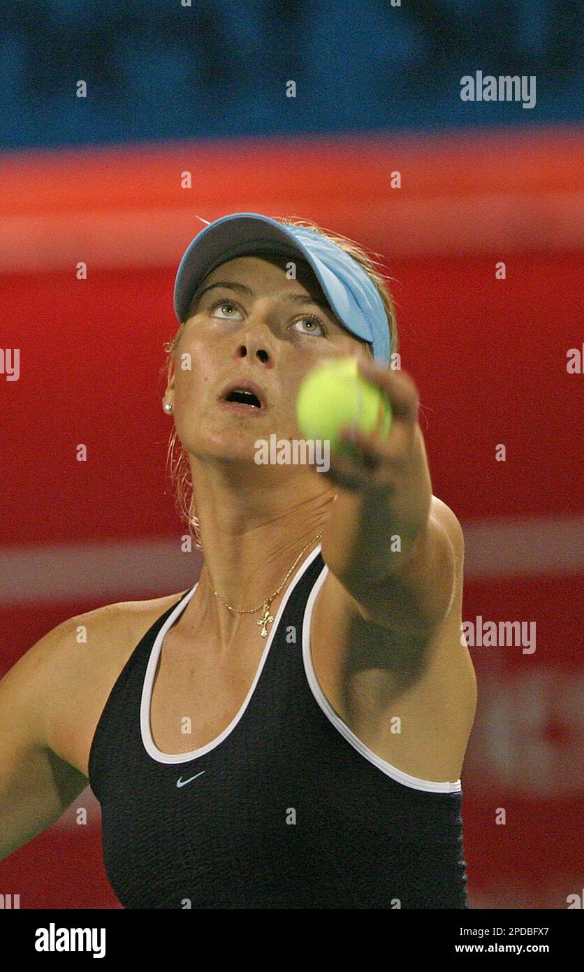 Maria Sharapova, of Russia, serves the ball to Lindsay Davenport, of ...