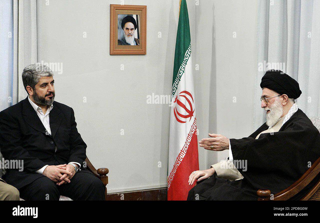 Iranian supreme leader Ayatollah Ali Khamenei, right, talks with Khaled ...
