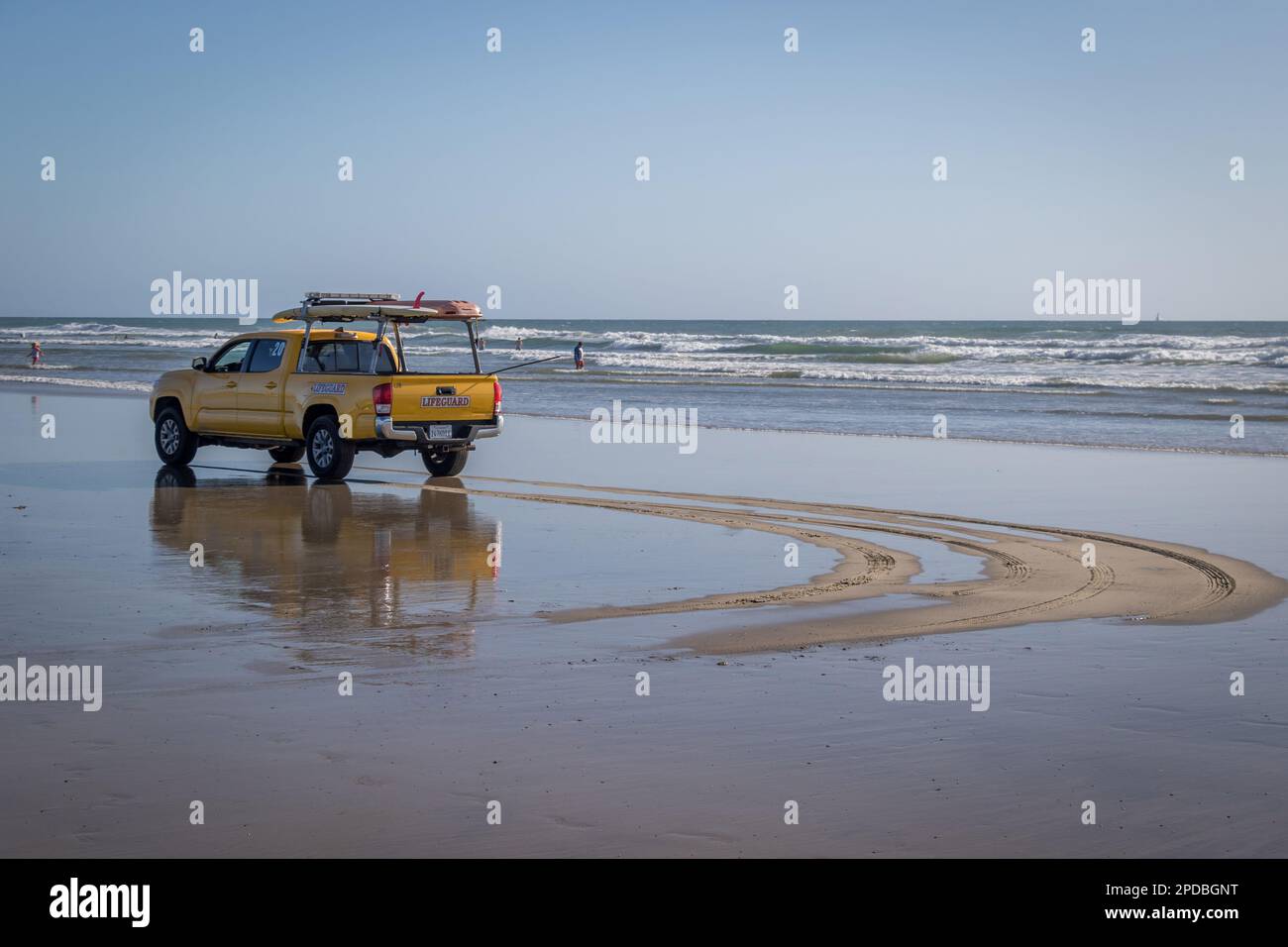 Yellow lifeguard truck on beach Stock Photo - Alamy