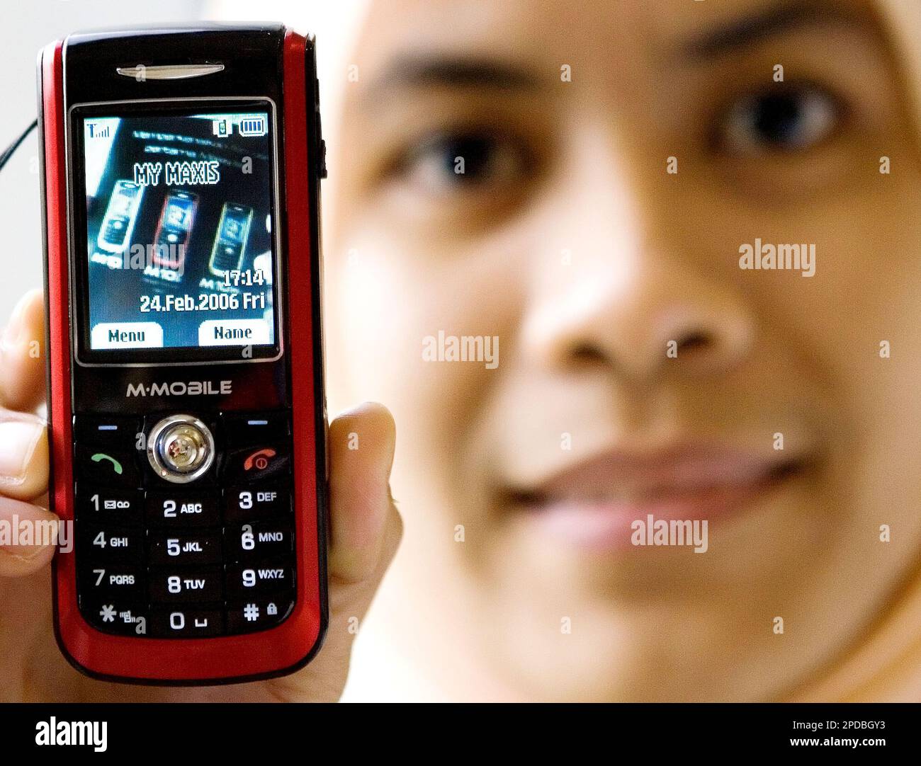 Noor Azrina, M.Mobile sales executive, shows the M10i, Malaysia's first ...