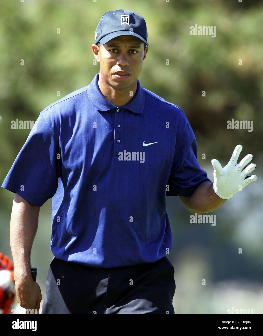 Tiger Woods acknowledges the applause after his birdie on the third ...