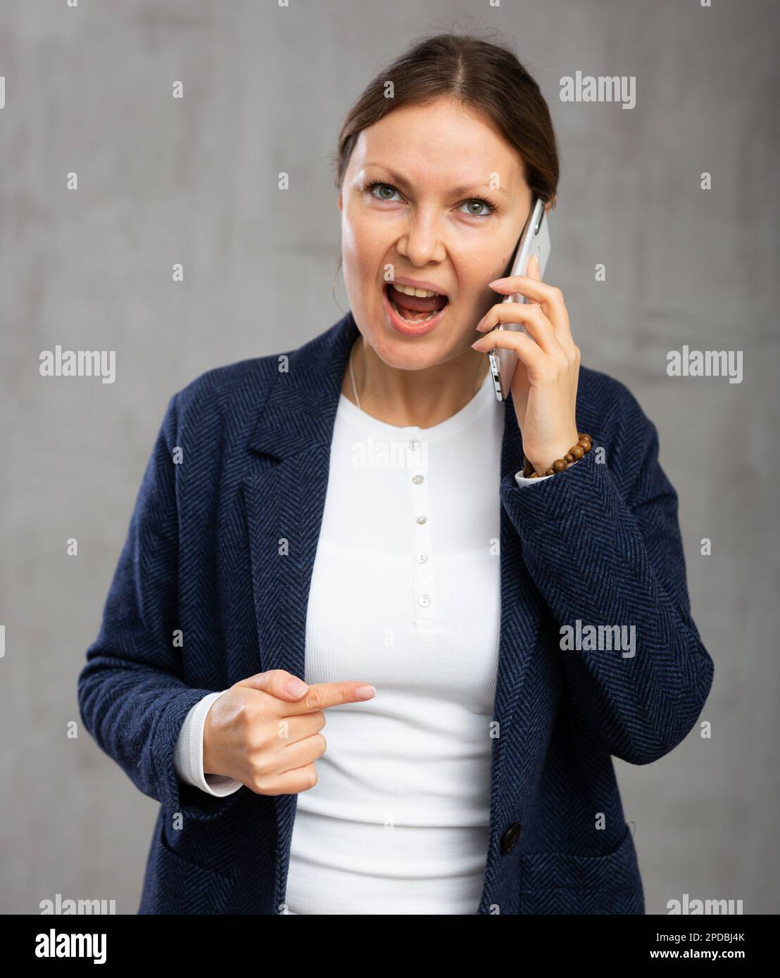 Woman irritated cellular phone hi-res stock photography and images - Alamy