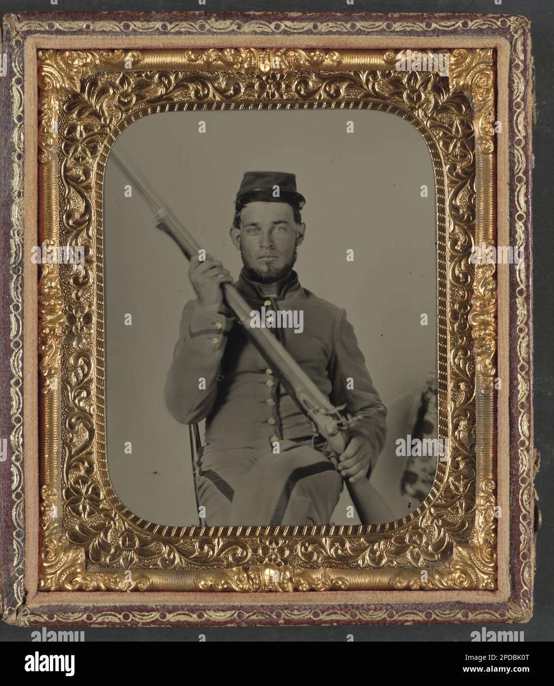 Unidentified soldier in Confederate uniform with flintlock musket ...