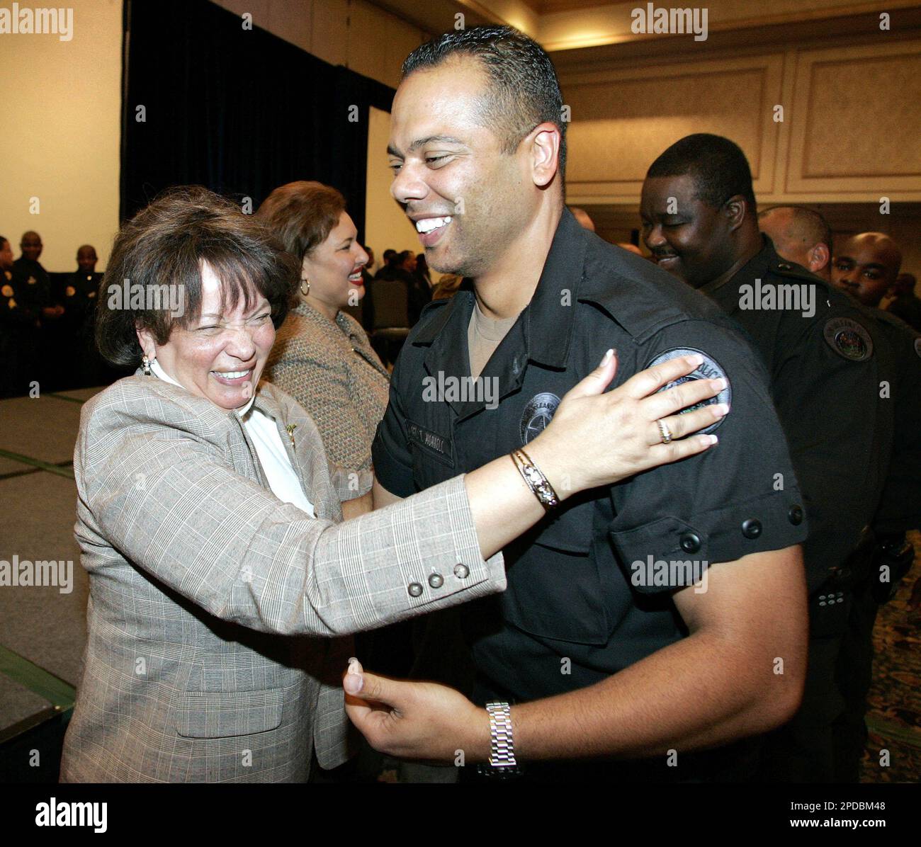 New Orleans Police SWAT Sgt. Todd Morrell right, gets a hug from his ...