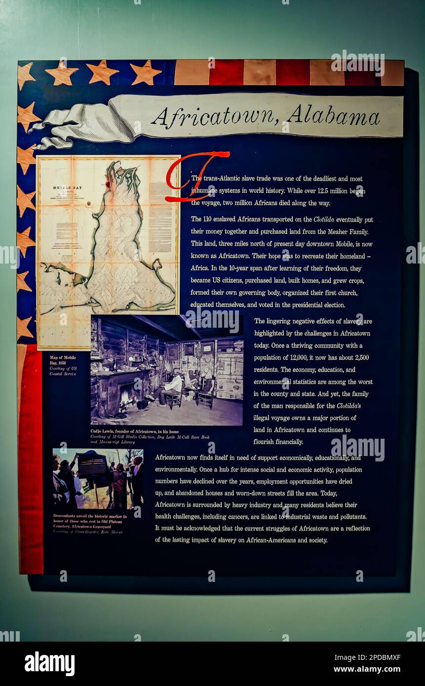 A poster tells the history of Africatown at the “Spirits of the Passage ...