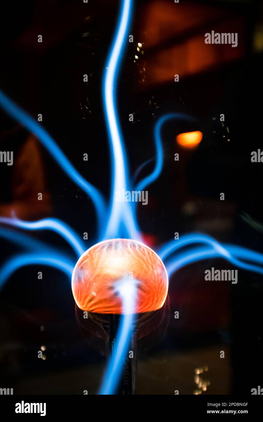 Energy rays from an orange core sphere Stock Photo - Alamy