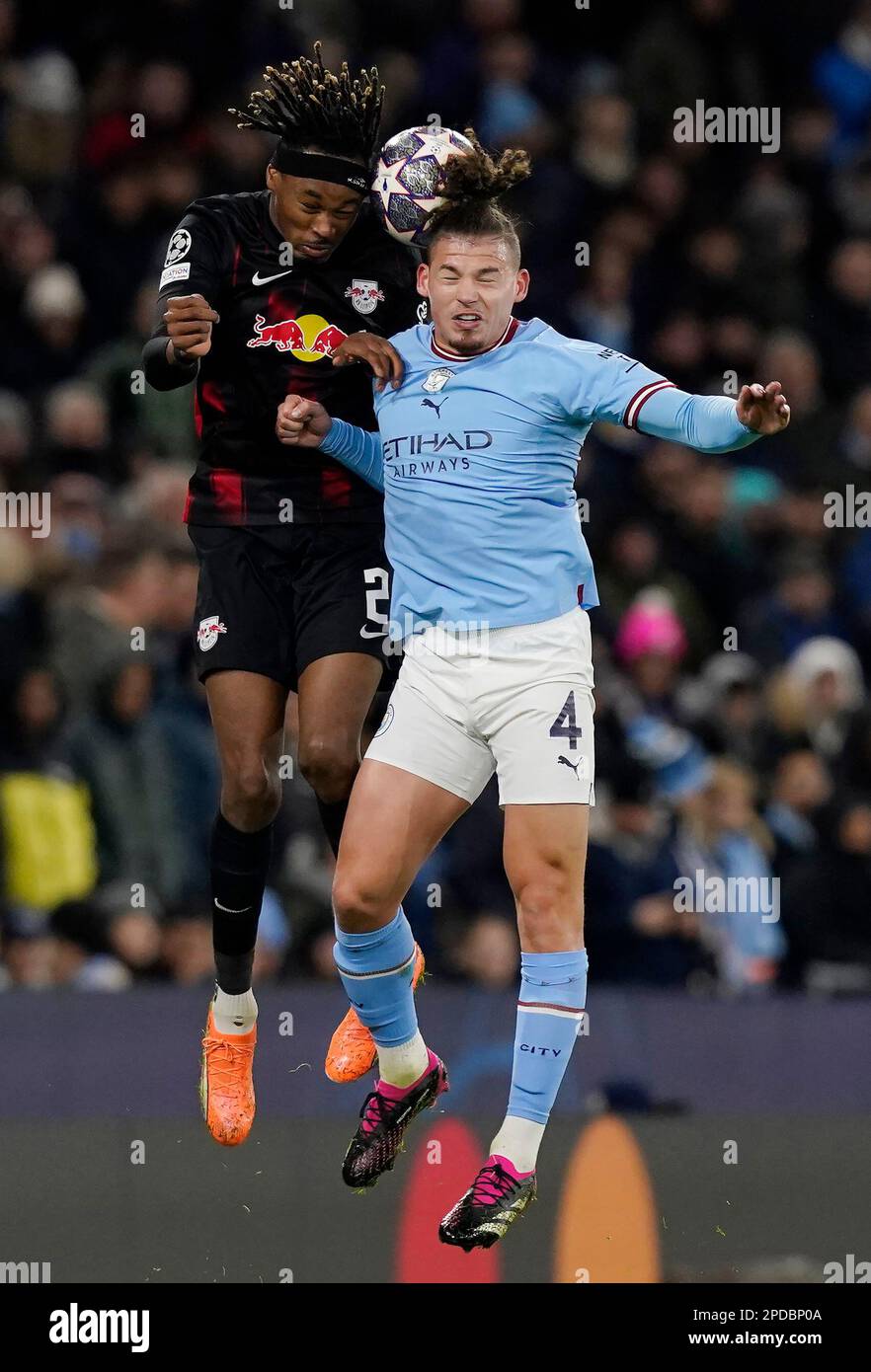 Manchester, UK. 14th Mar, 2023. Mohamed Simakan of RB Leipzig tussles with Kalvin Phillips of ...