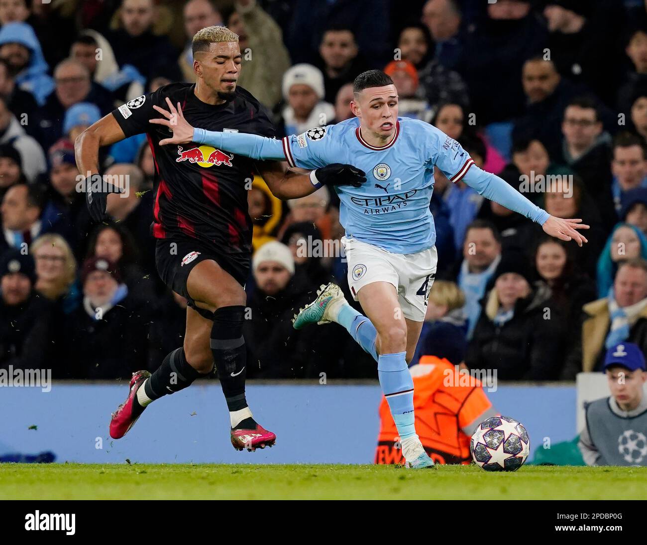 Manchester, UK. 14th Mar, 2023. Benjamin Henrichs of RB Leipzig challenges Phil Foden of ...