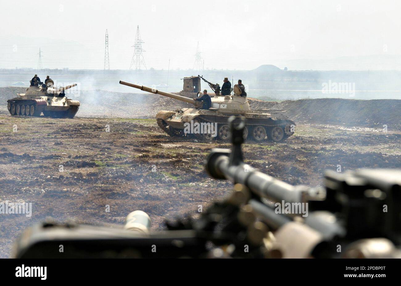 Kurdish peshmerga troops drive their T-54/55 soviet made tanks during ...