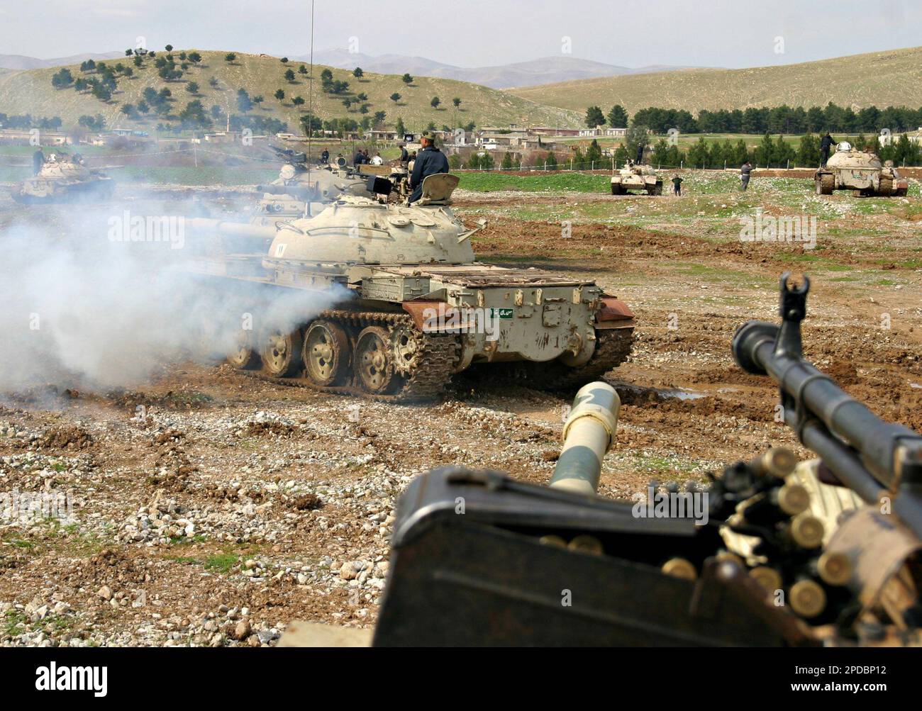 Kurdish peshmerga troops drive their T-54/55 soviet made tanks during ...