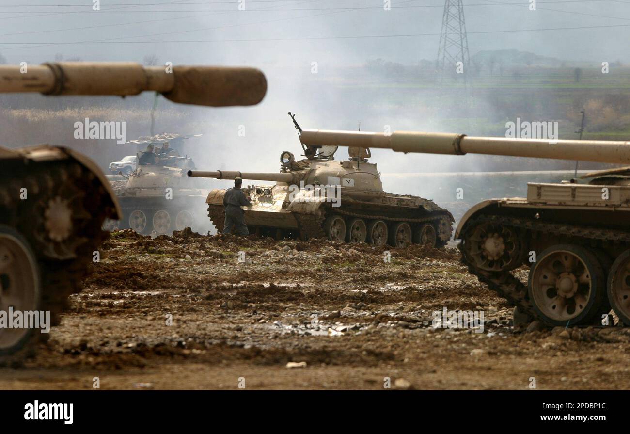 Kurdish peshmerga troops drive their T-54/55 soviet made tanks during ...