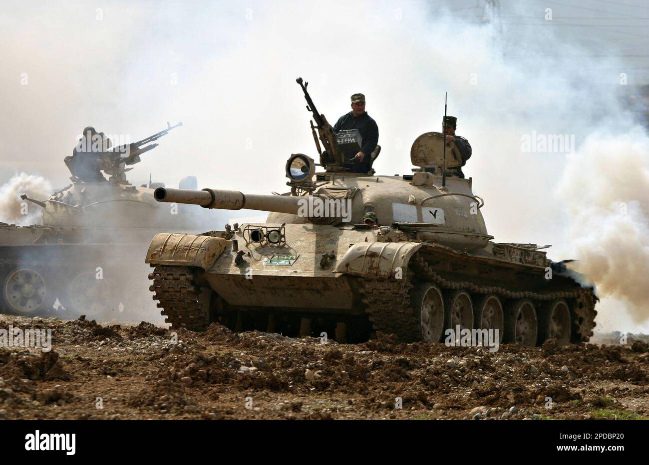 Kurdish peshmerga troops drive their T-54/55 soviet made tanks during ...