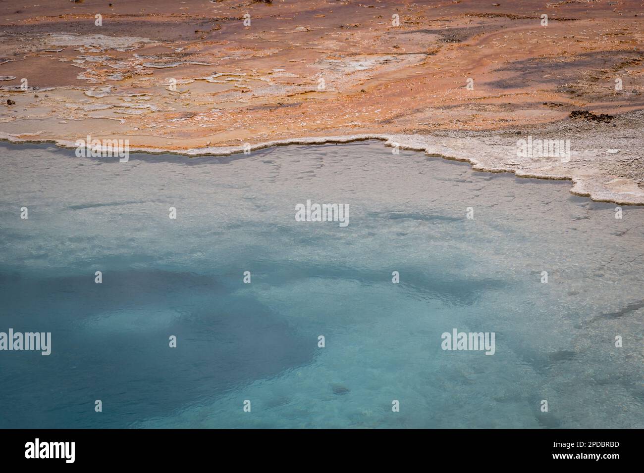 Blue water with orange rust color ground of a colorful hot spring at ...