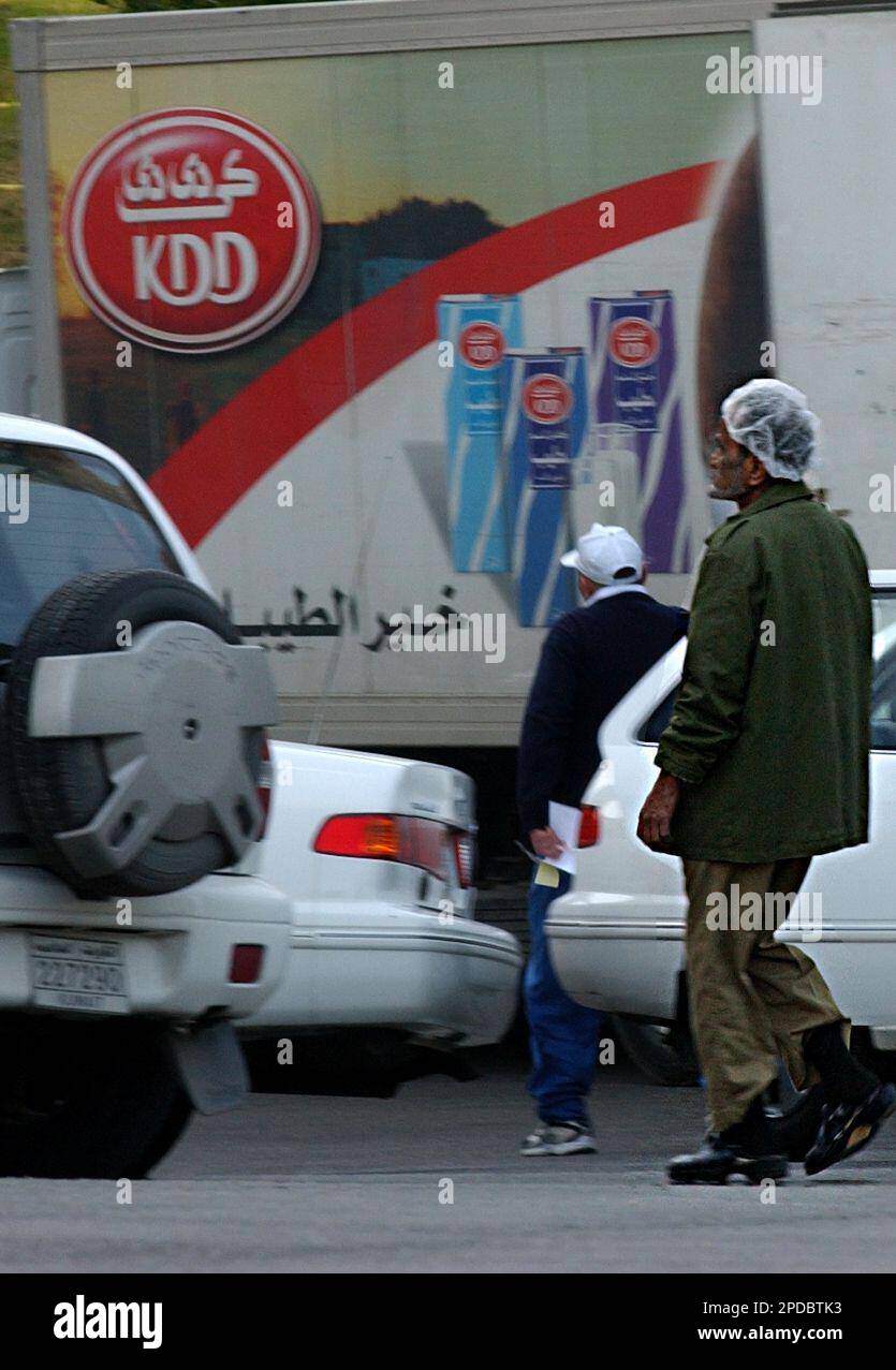 Workers for the Kuwait Danish Dairy Company at the plant's office at ...