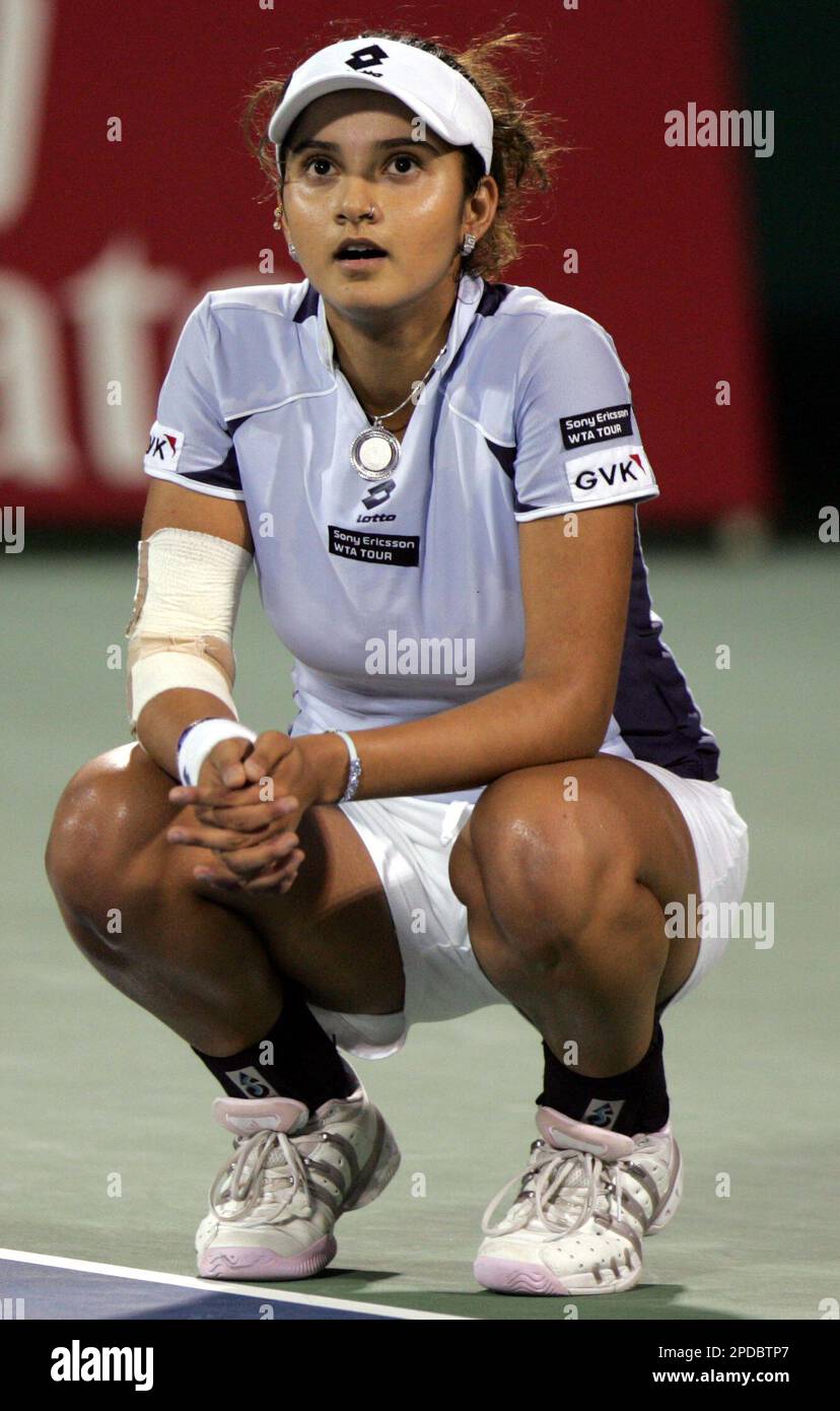 India's Sania Mirza looks upset after she loses a point in a match with ...