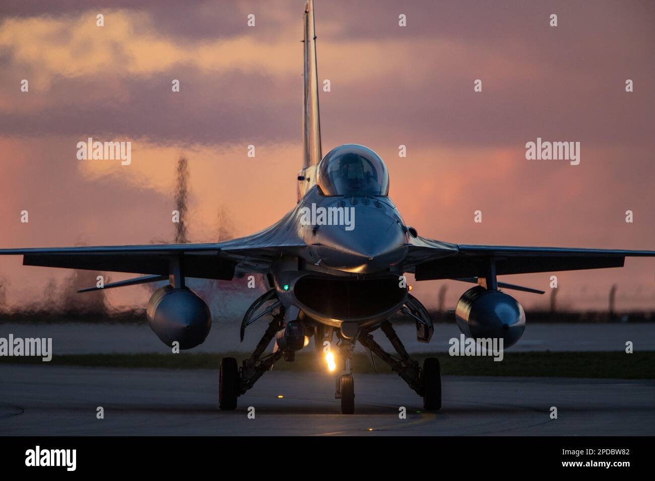 Belgian Air Force F-16AM taxiing against the setting sun at RAF ...