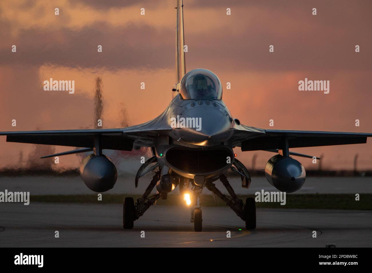 Belgian Air Force F-16AM taxiing against the setting sun at RAF ...