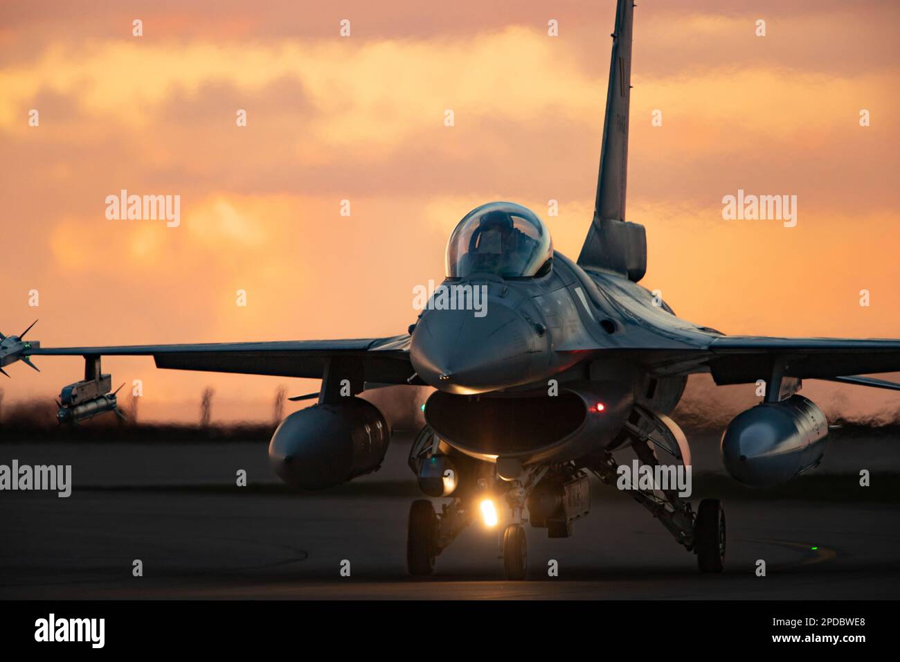 Belgian Air Force F-16AM taxiing against the setting sun at RAF ...