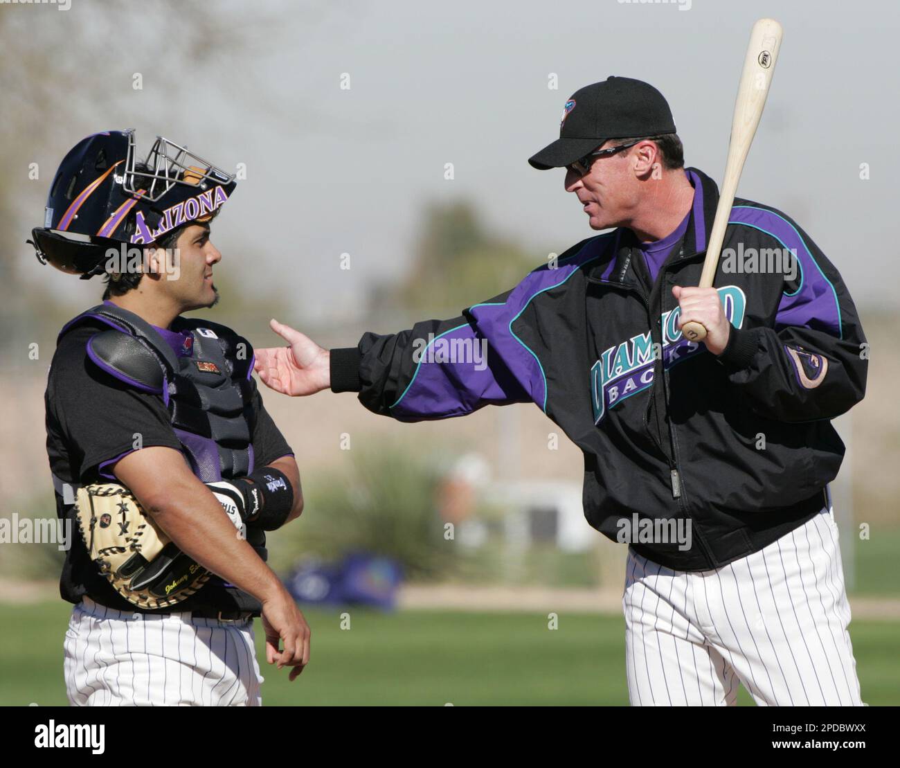 Arizona Diamondbacks catcher Johnny Estrada, left, listens to manager ...