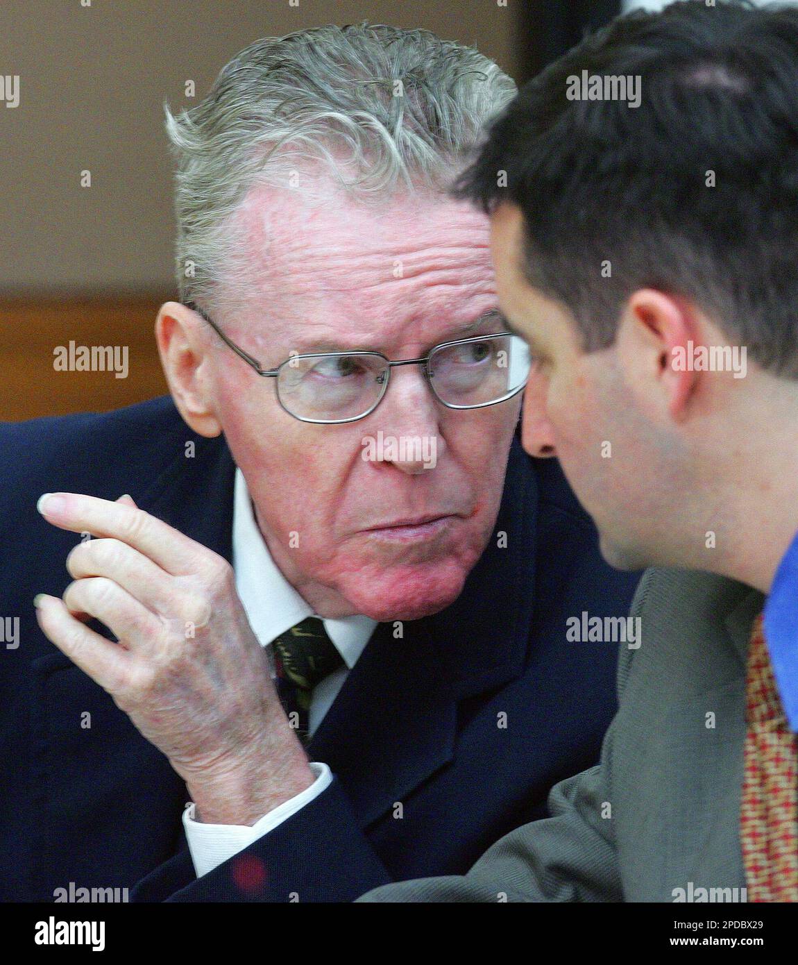 James Sullivan, left, confers with attorney Josh Moore, right, as the ...